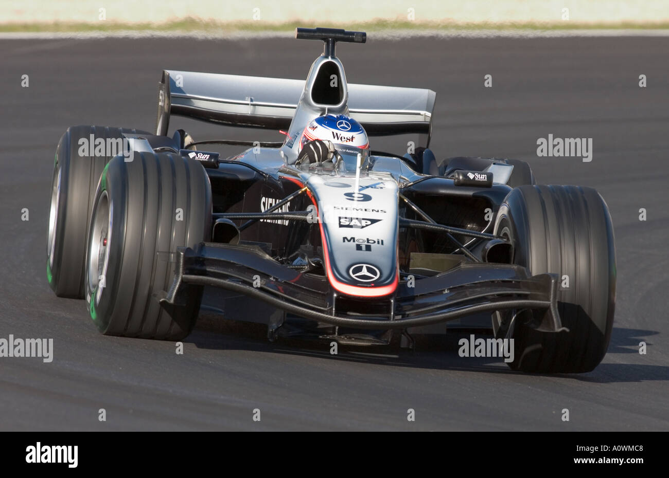 Driver Kimi Raikkonen from Finland in his McLaren Mercedes racing car ...