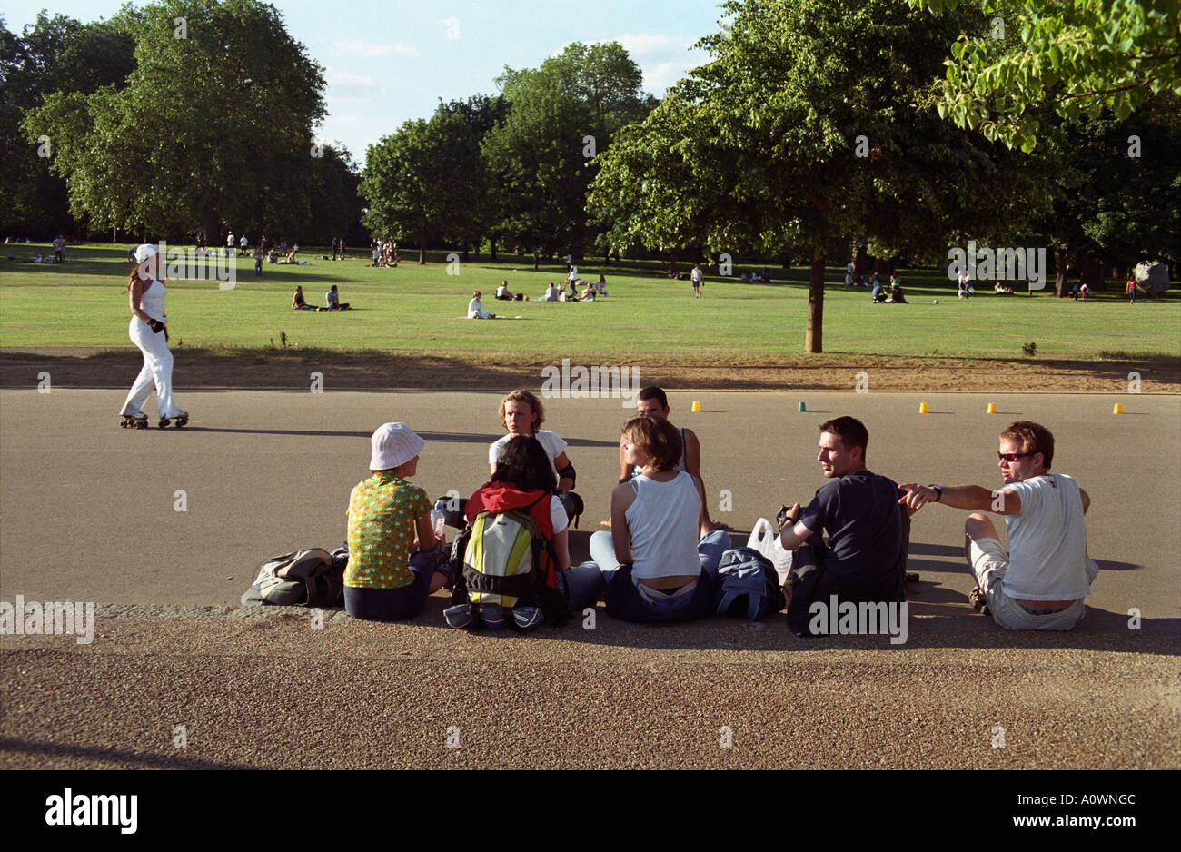 United Kingdom, England, London. Group of young friends at Hyde Park ...