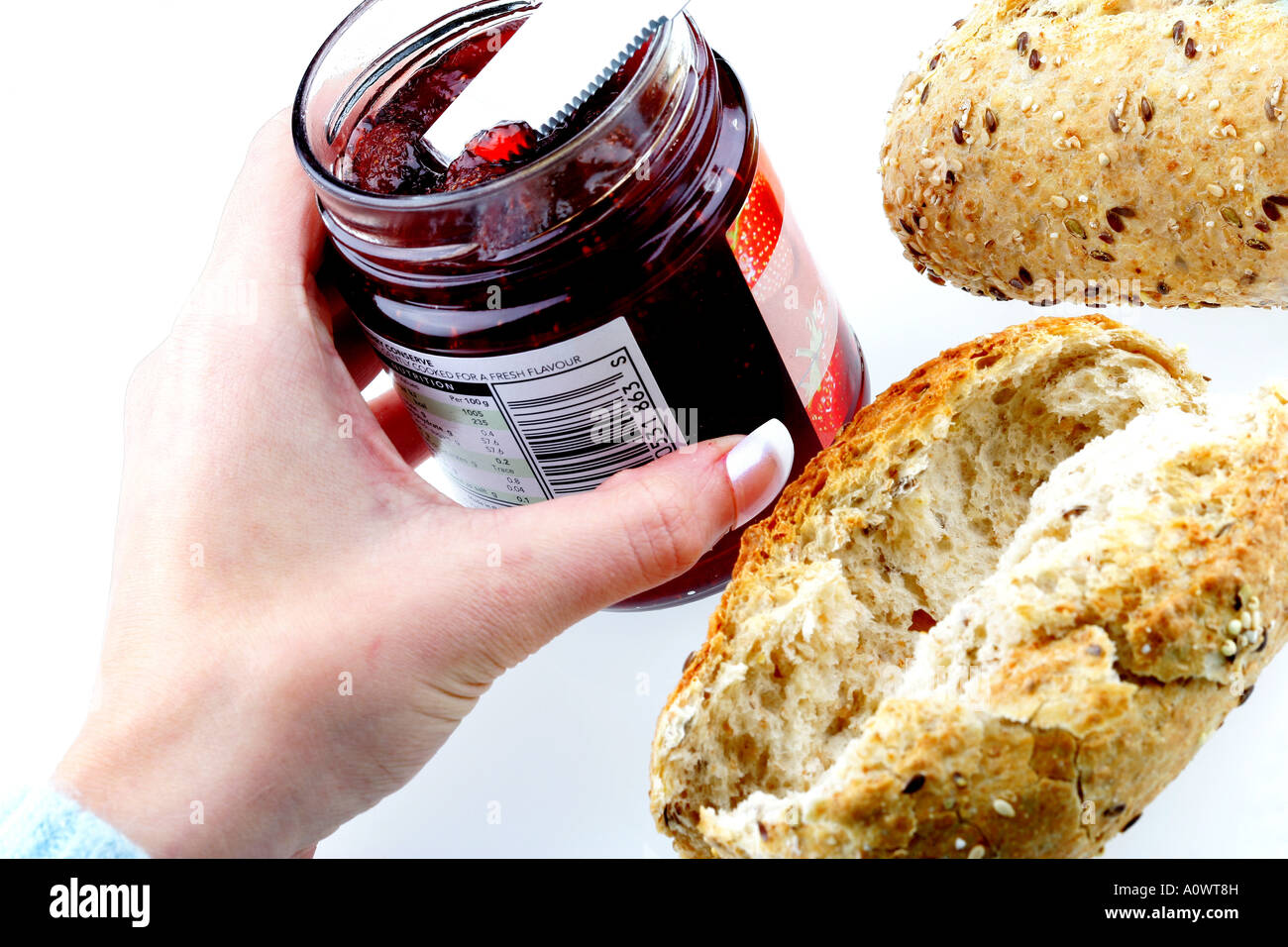 Spreading Jam on a Roll Stock Photo - Alamy