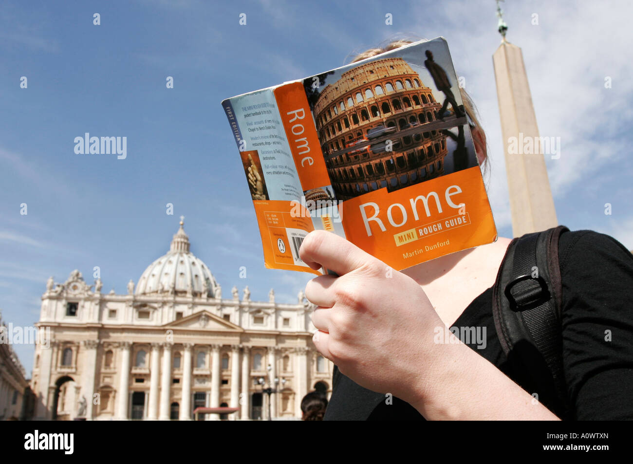 Italy Roma Rome St Peters Square Young woman reading Rome guide book ...