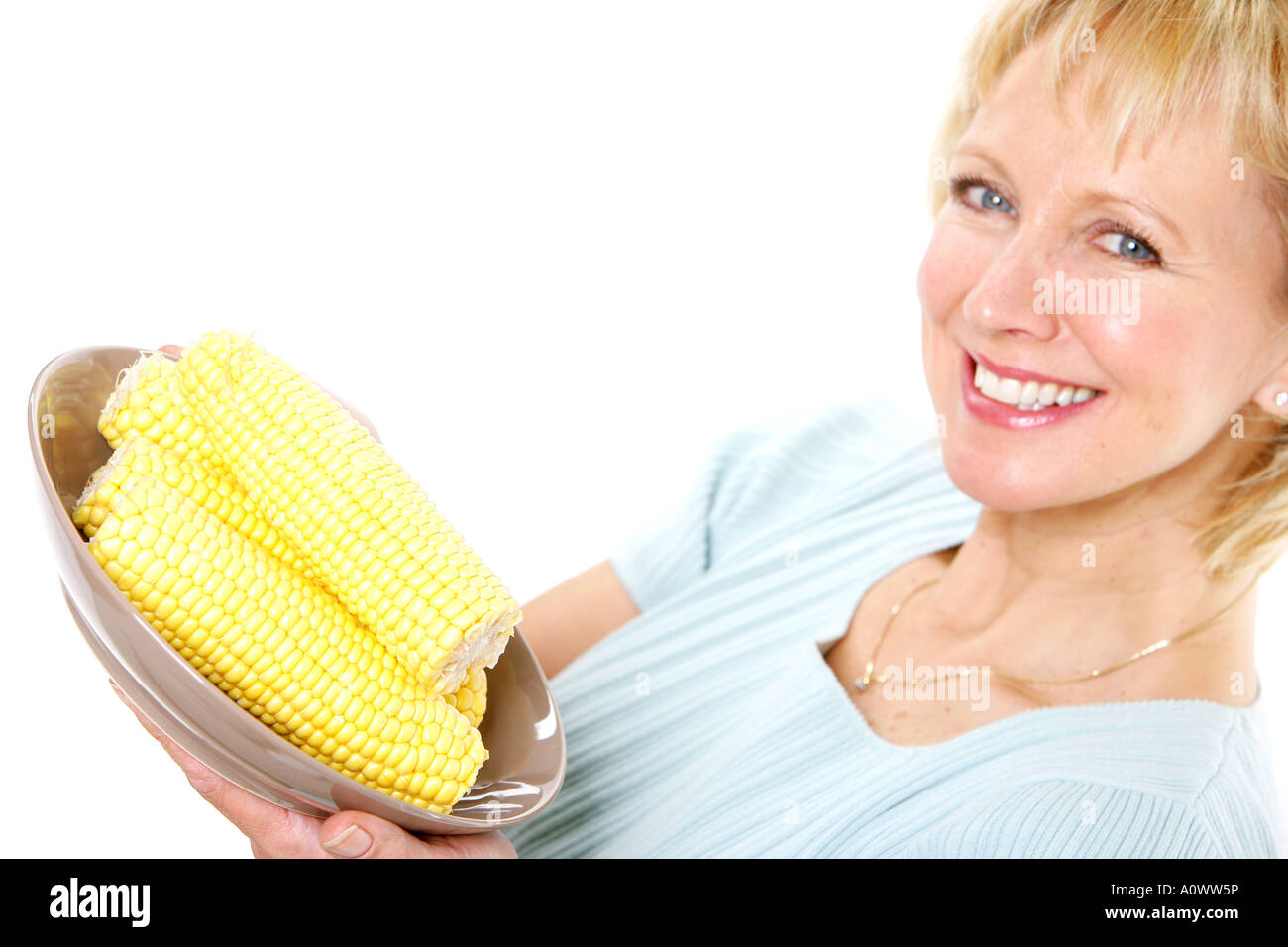 Mature Woman Holding Plate of Corn on The Cob Model Released Stock ...