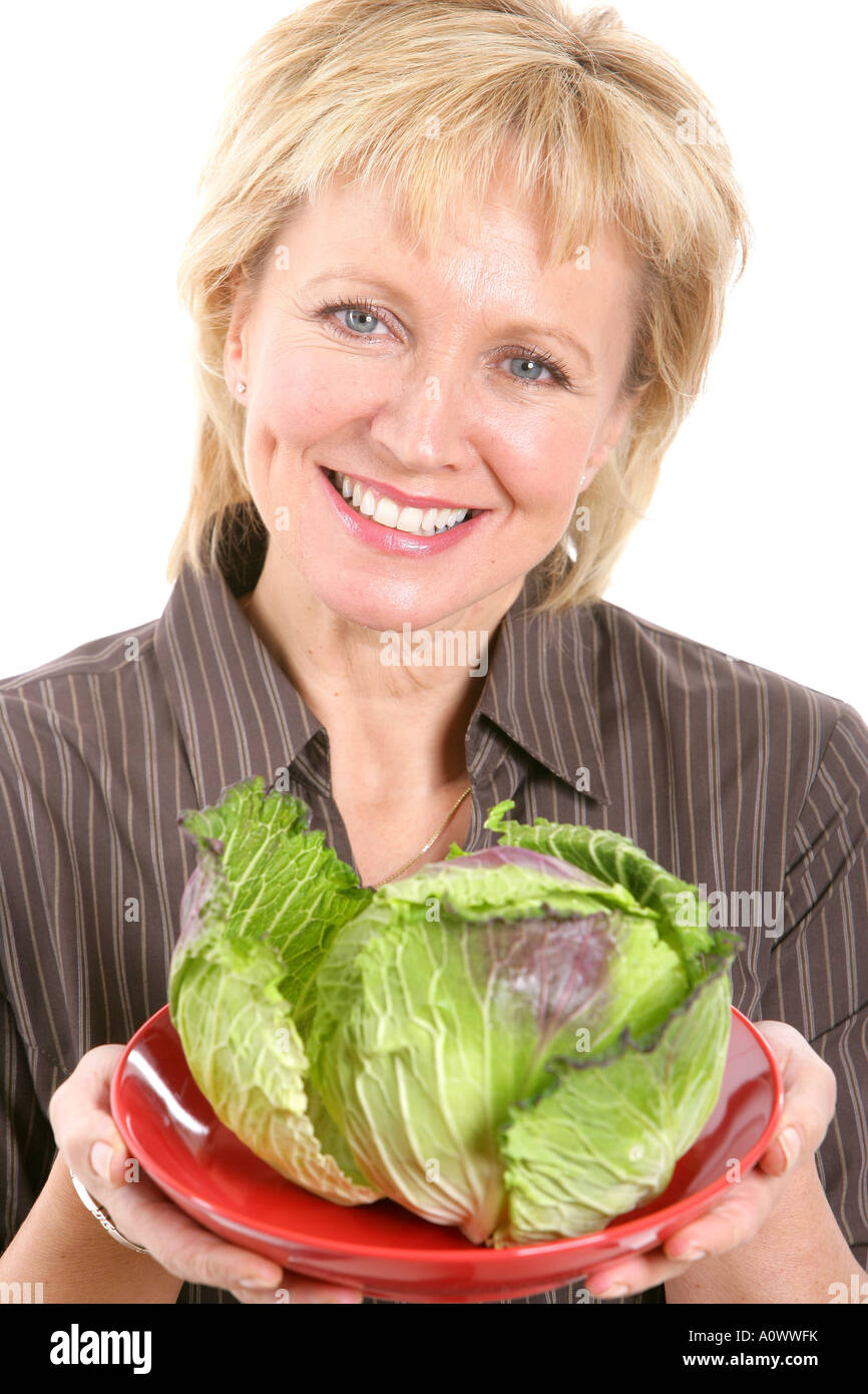 Mature Older Middle Aged Woman Holding A Red Plate With A Fresh Raw ...