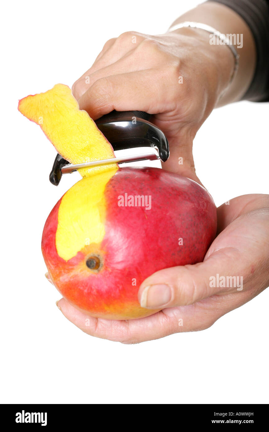 Woman Peeling A Mango Model Released Stock Photo - Alamy