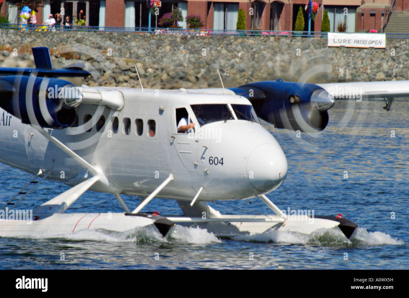 Closeup of twin engine commuter float plane arriving in inner harbour ...