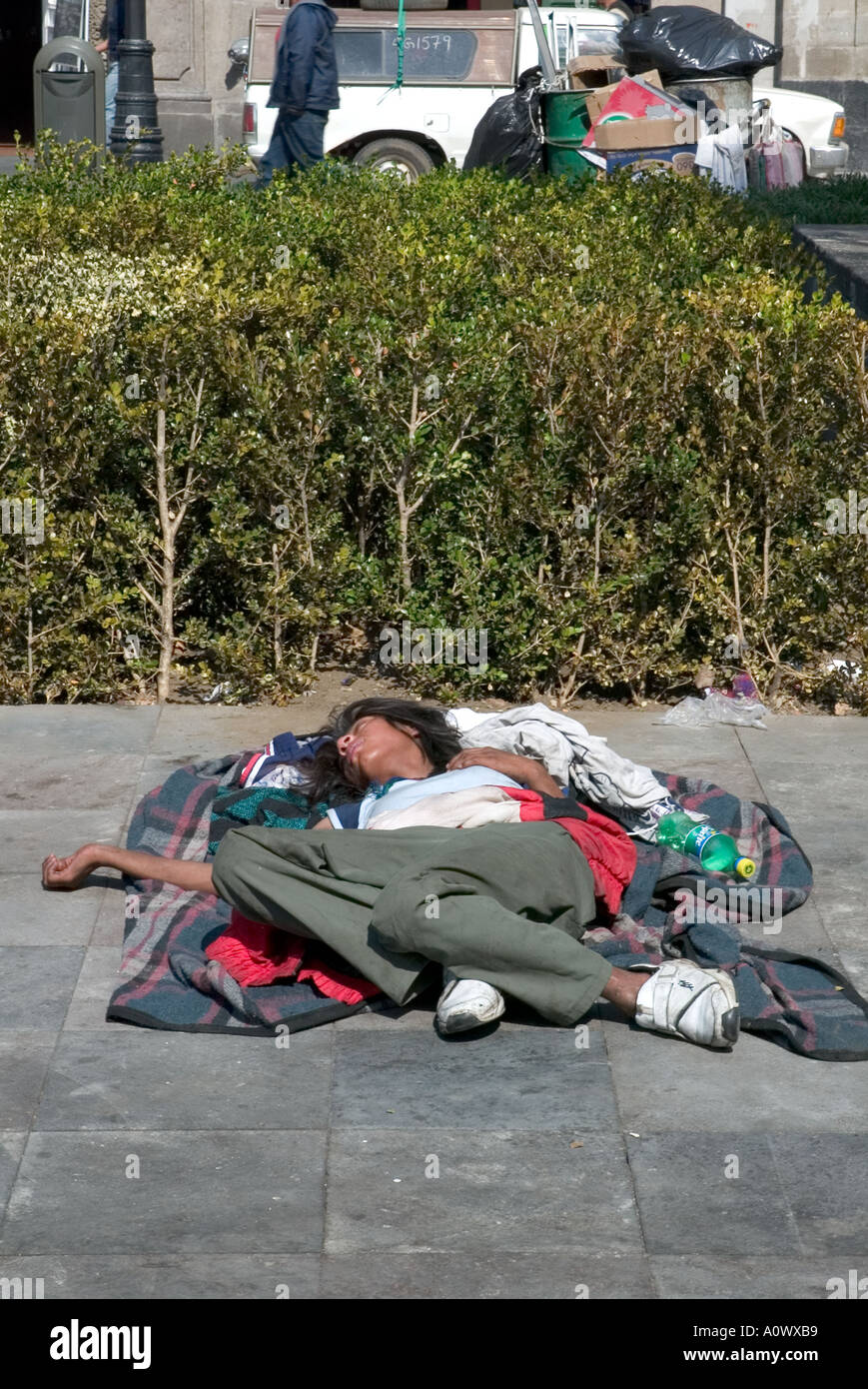 Homeless person sleeping on the streets of Mexico City in day time ...