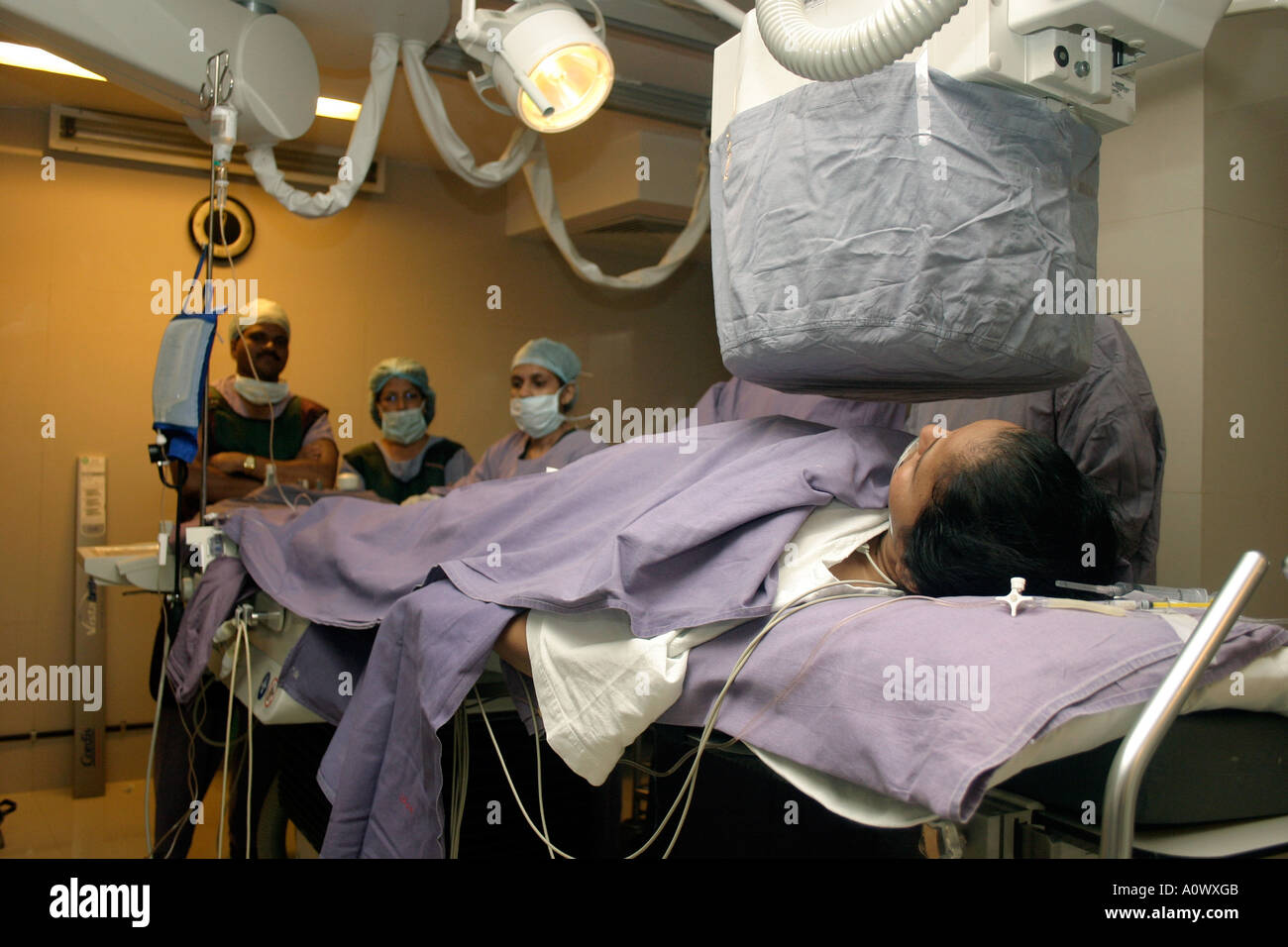 Surgeons getting ready to perform a cardiac procedure Stock Photo - Alamy