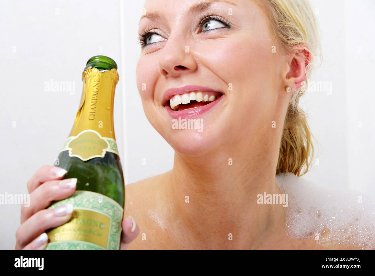 Young Woman Drinking Champagne in the Bath Model Released Stock Photo ...