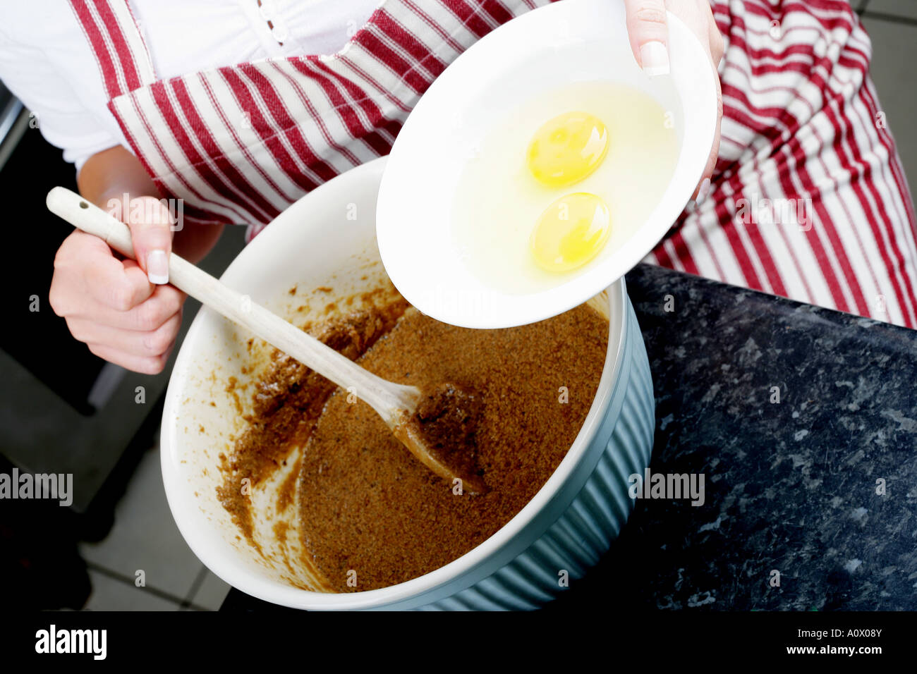 Young Woman Making a Cake Model Released Stock Photo - Alamy