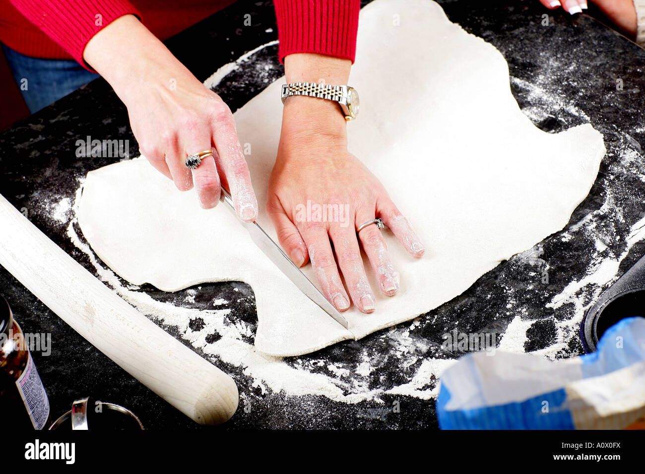 Young Woman Cutting Pastry Model Released Stock Photo - Alamy