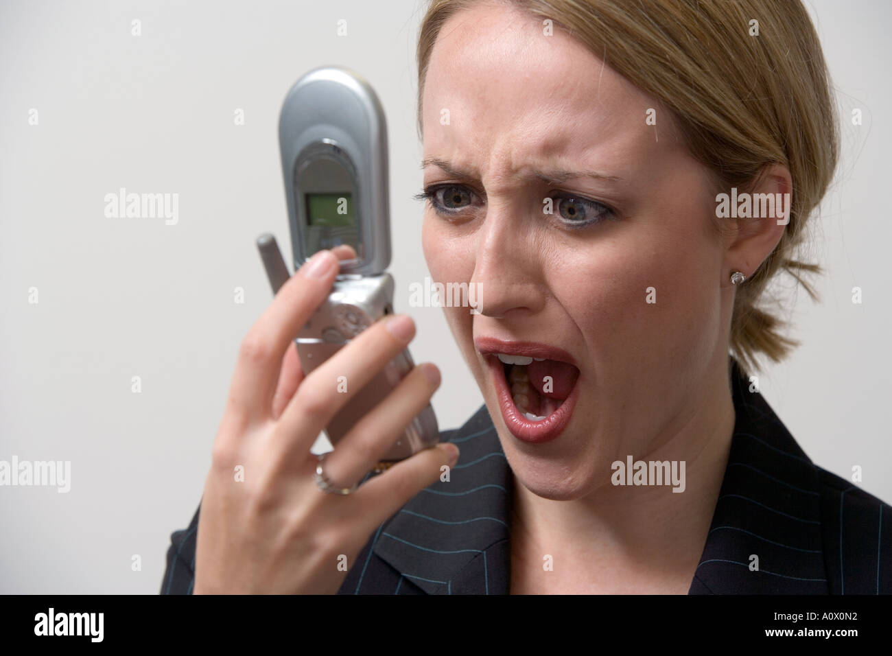 Screaming on the phone hi-res stock photography and images - Alamy