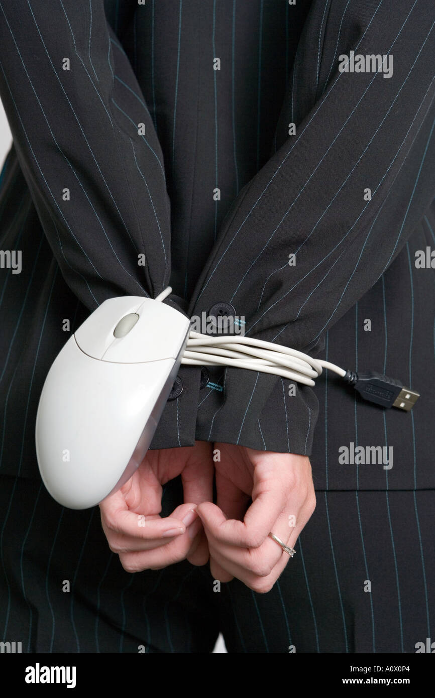 female executive office worker is tied to computer mouse Stock Photo ...