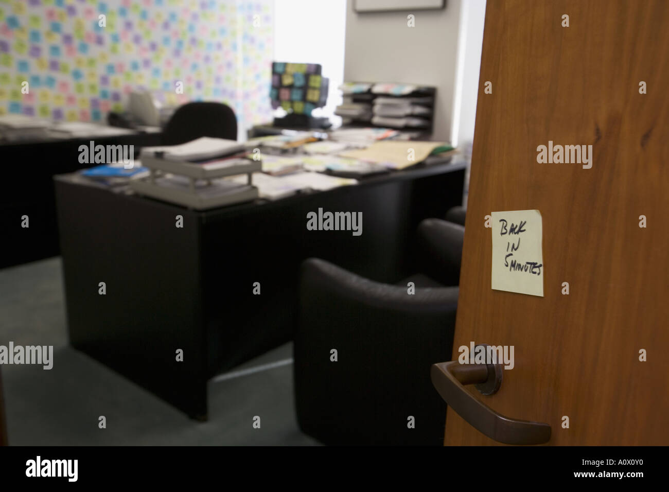 messy office is filled with reminder sticky notes Stock Photo - Alamy