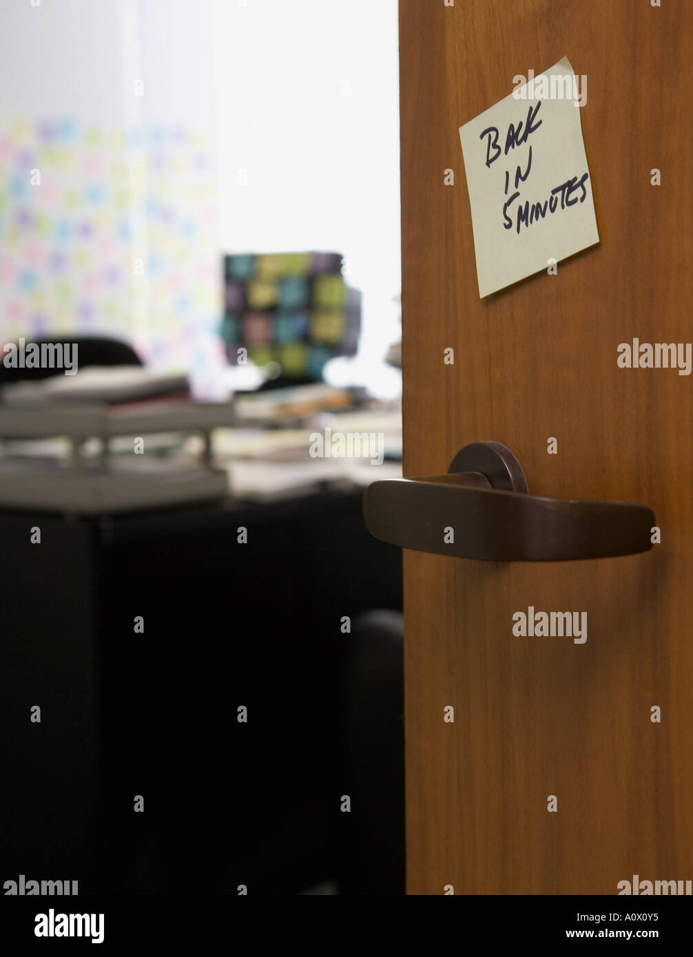 messy office is filled with reminder sticky notes Stock Photo - Alamy