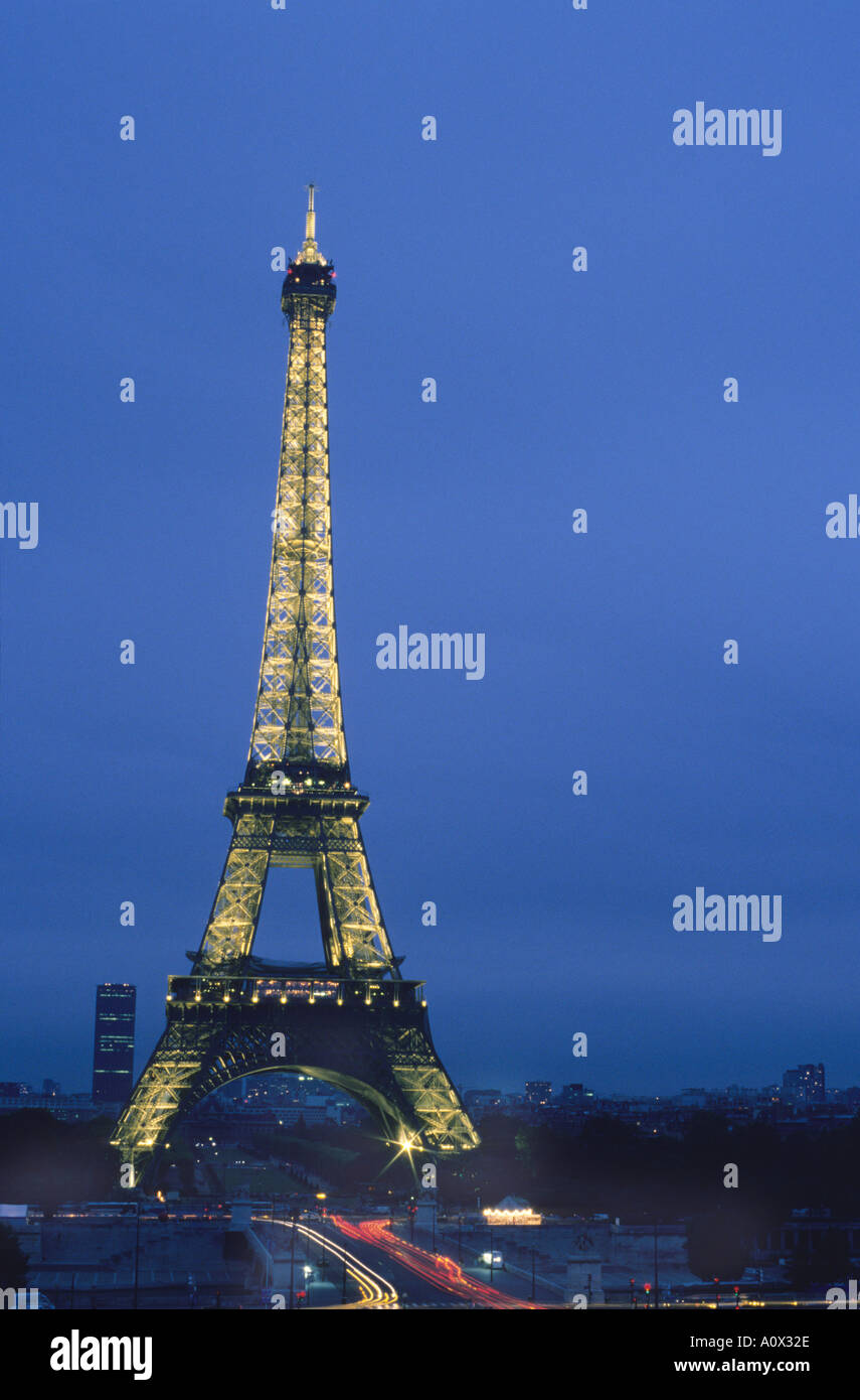 The Eiffel Tower lit up at night in Paris France Stock Photo - Alamy