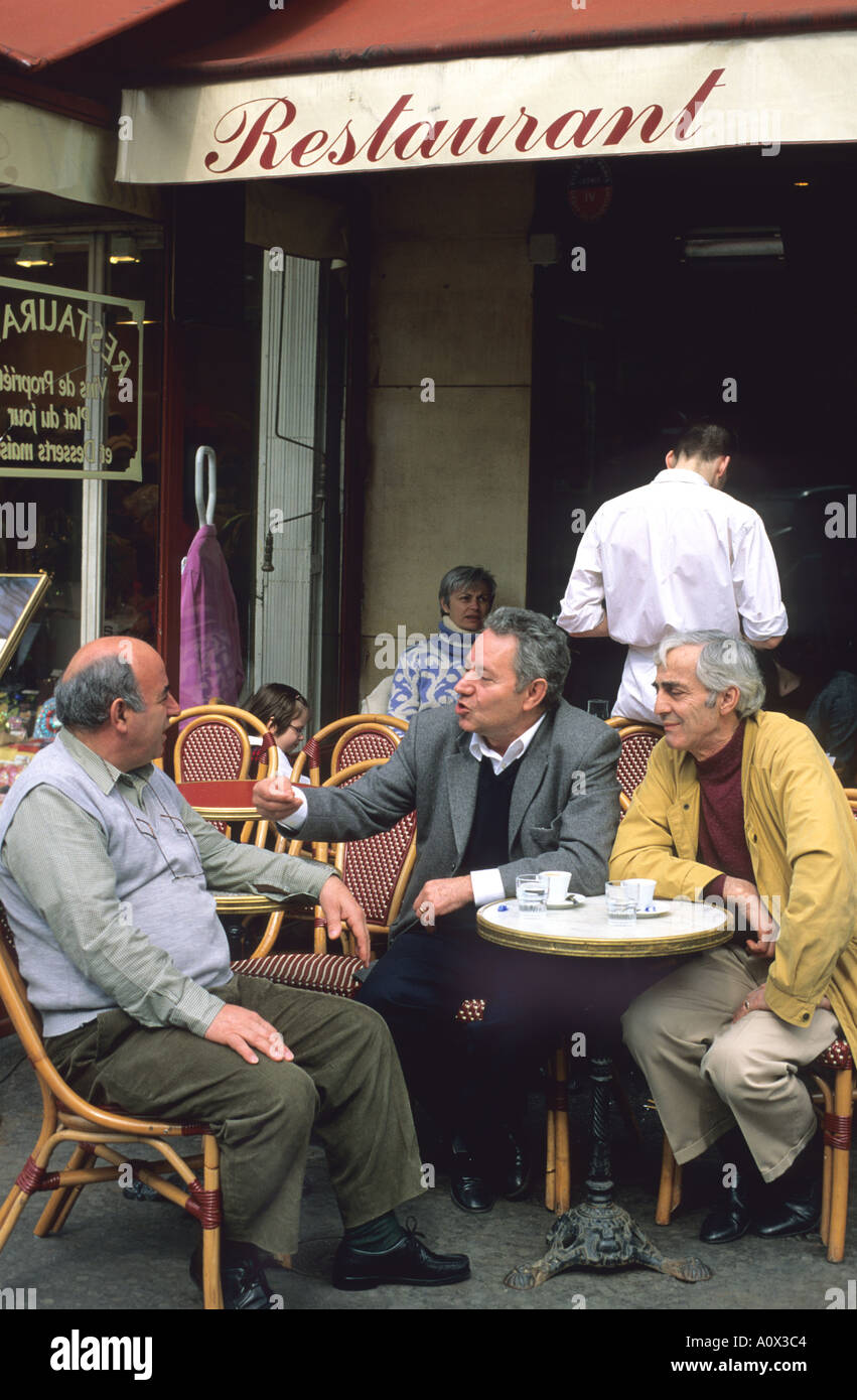 French men talking at a sidewalk cafe in Paris France Stock Photo - Alamy