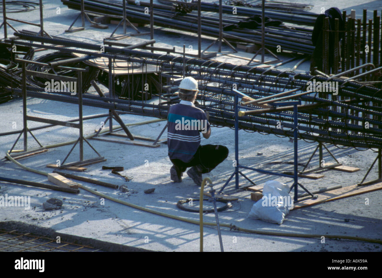 Steel fixer making up a reinforcement cage on a construction site Stock ...