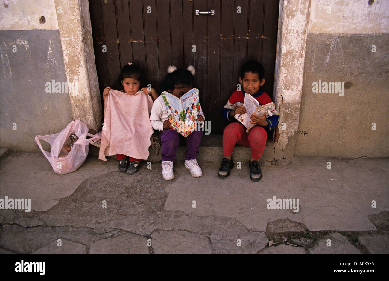 Sorata, Bolivia. Children with school books and toys Stock Photo - Alamy