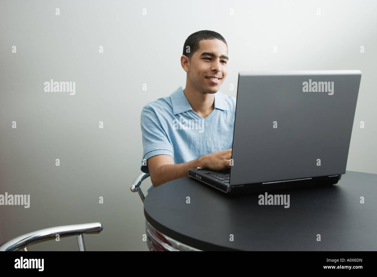 Young African man using laptop Stock Photo - Alamy