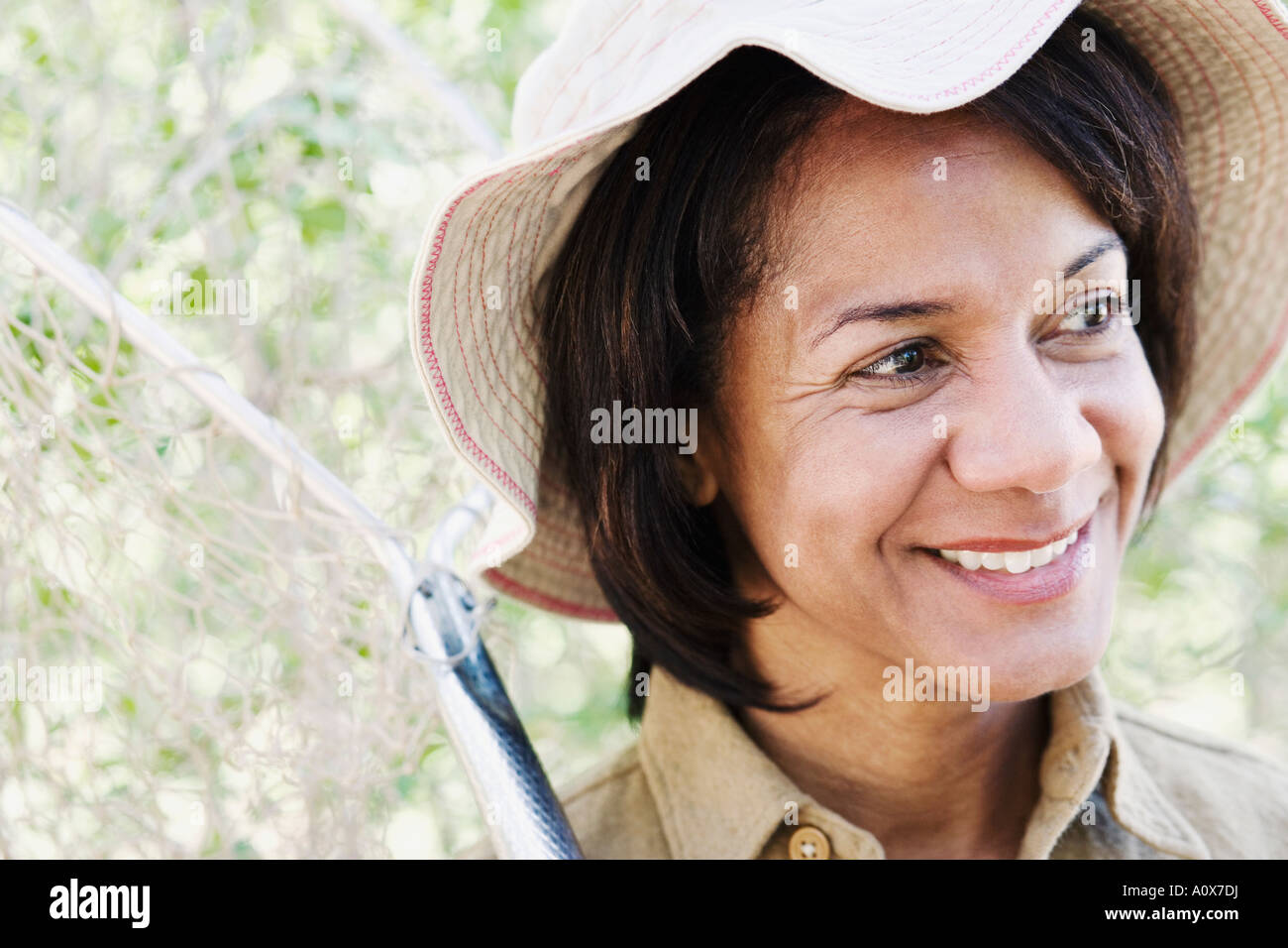 Close up of African woman smiling and holding net Stock Photo - Alamy
