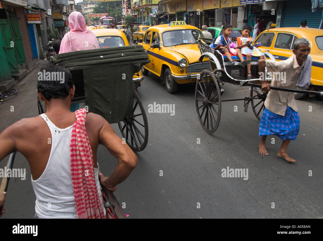 India West Bengal Kolkata Hand pulled rickshaw road scene with hand ...