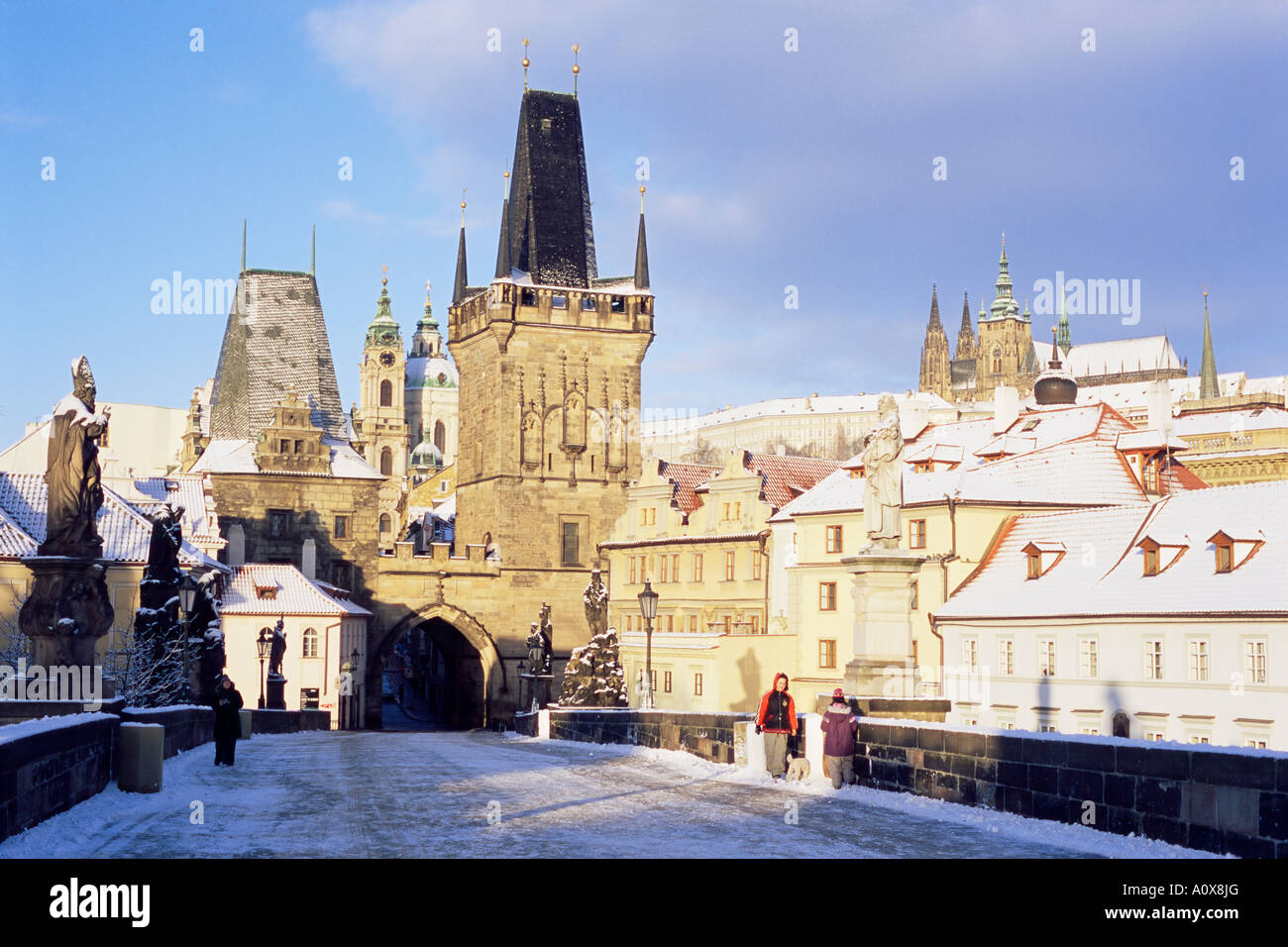 Snow covered Gothic Charles bridge with Baroque statues Romanesque and ...