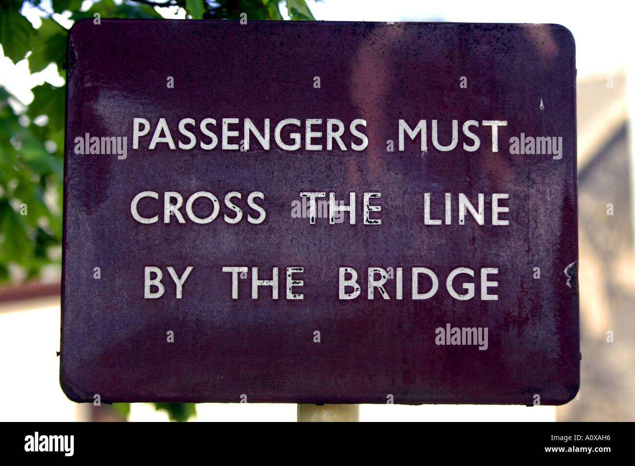 passengers must cross the line by the bridge sign Stock Photo - Alamy