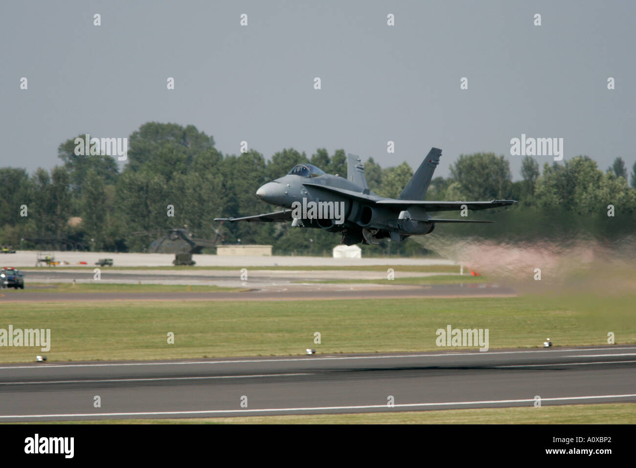 Finnish AF F 18C Hornet takes off from runway with full afterburner and ...