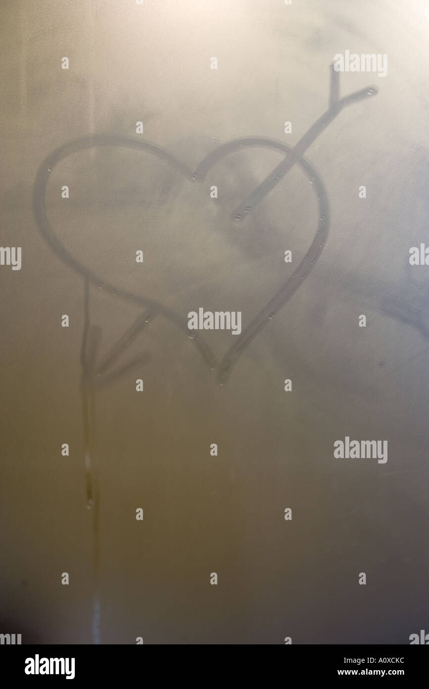 Heart and arrow on foggy window Stock Photo - Alamy