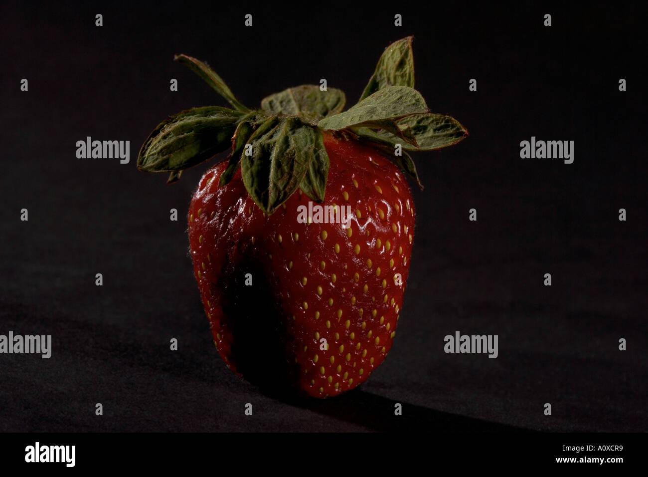 Strawberry on black background Stock Photo - Alamy