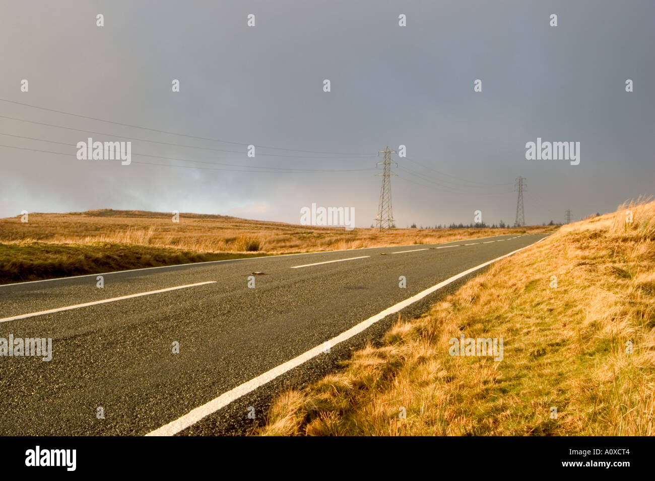 Remote Welsh moorland road and pylons Stock Photo - Alamy
