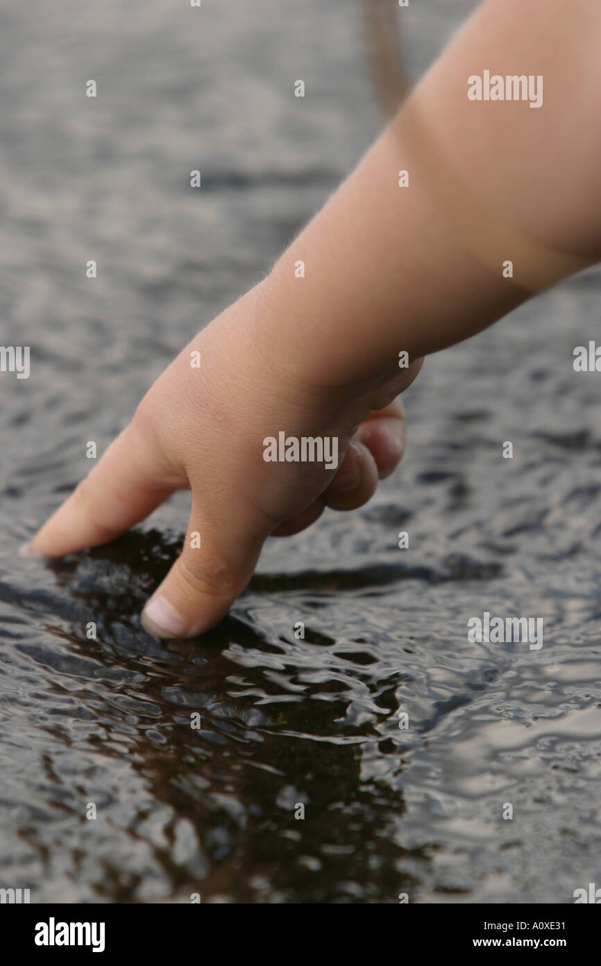 Finger touching water surface reflection hi-res stock photography and ...