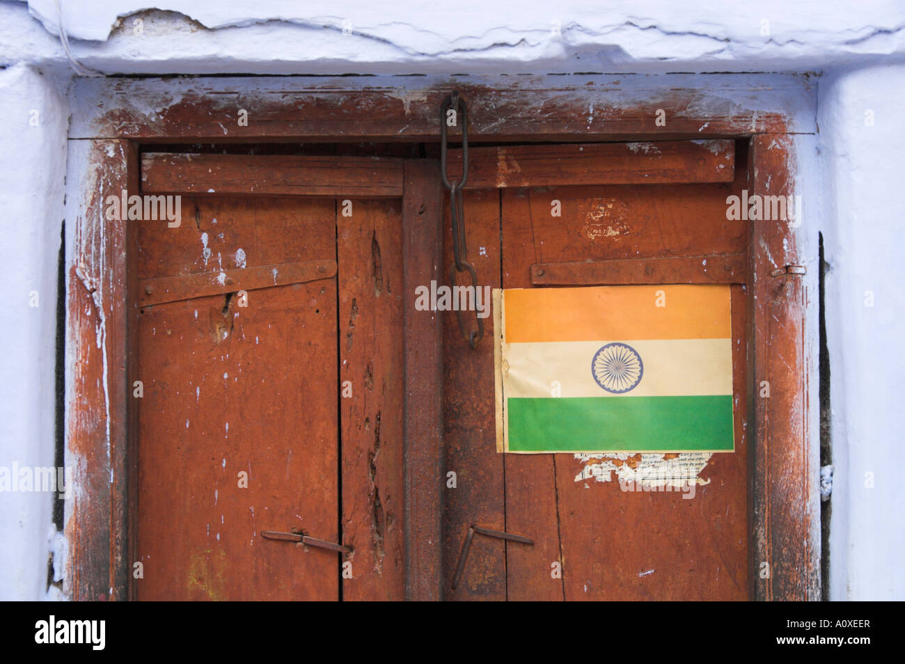 India Rajasthan Udaipur old city paper indian flag on old wooden door ...