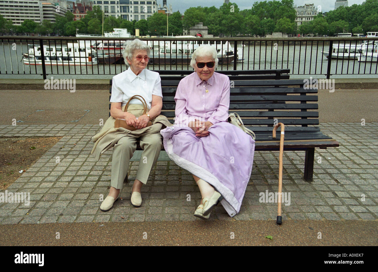 United Kingdom, England, London. Elderly local residents relaxing along ...