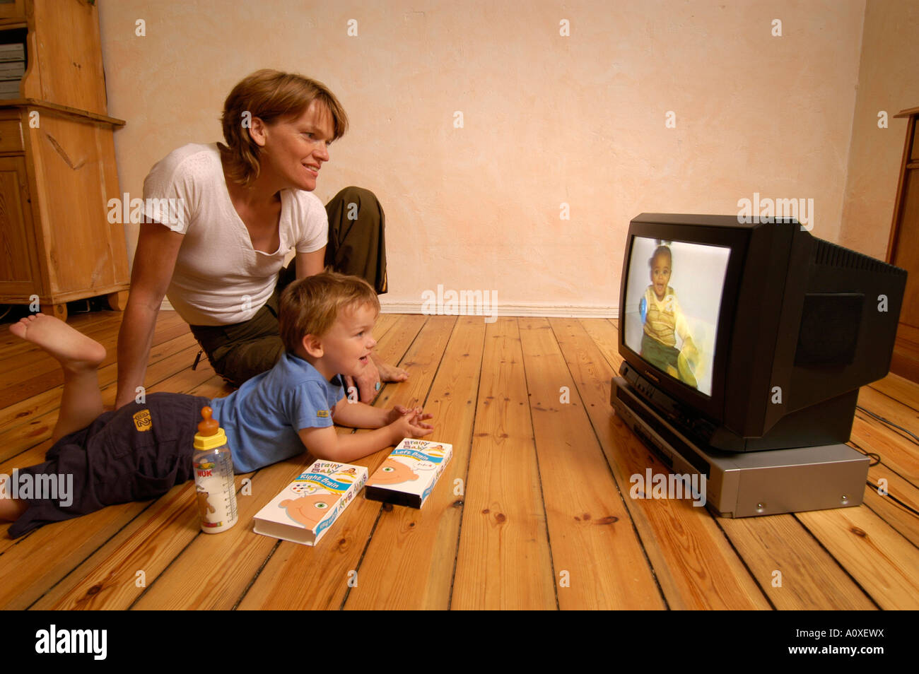 Mother and child watching a video Stock Photo - Alamy