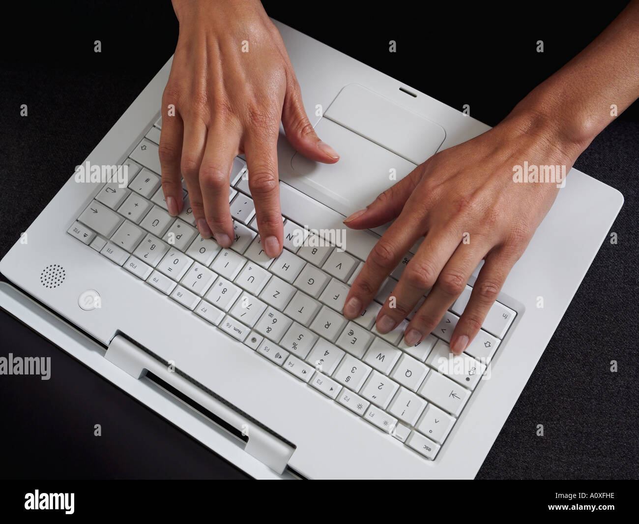 Woman typing on laptop computer Stock Photo - Alamy