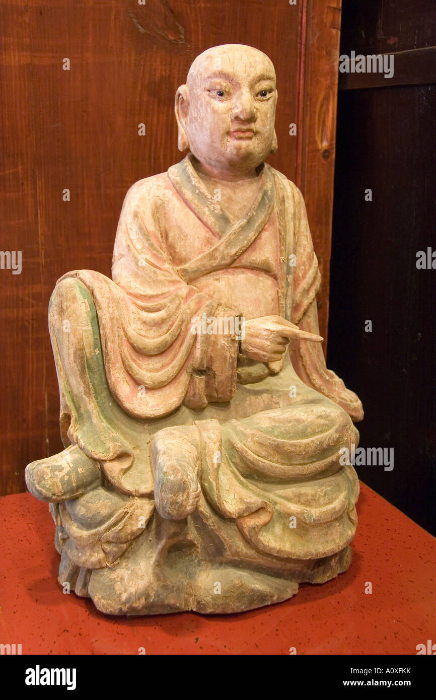 Buddhist monk figure sits hi-res stock photography and images - Alamy