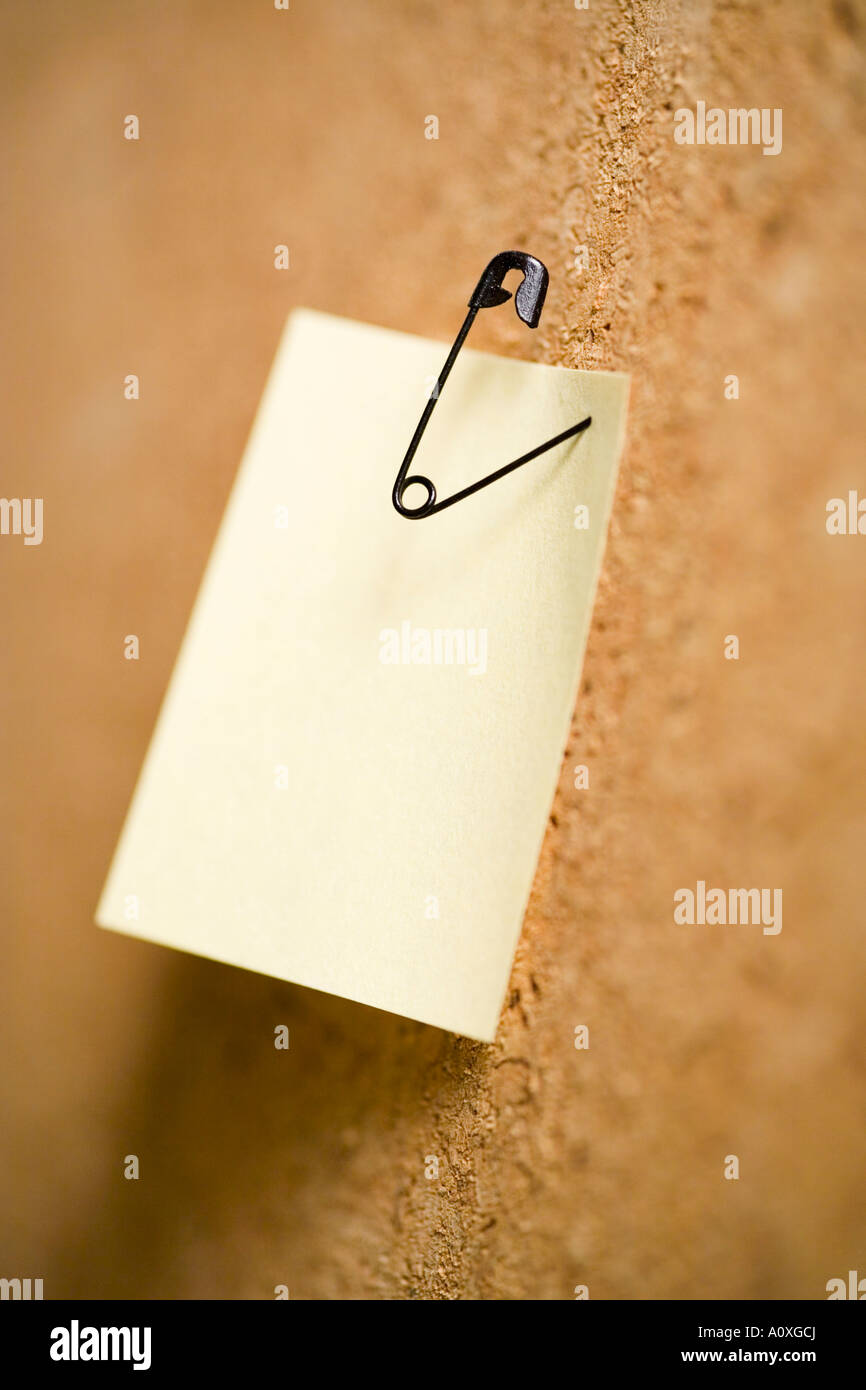 Paper on a pinboard Stock Photo - Alamy