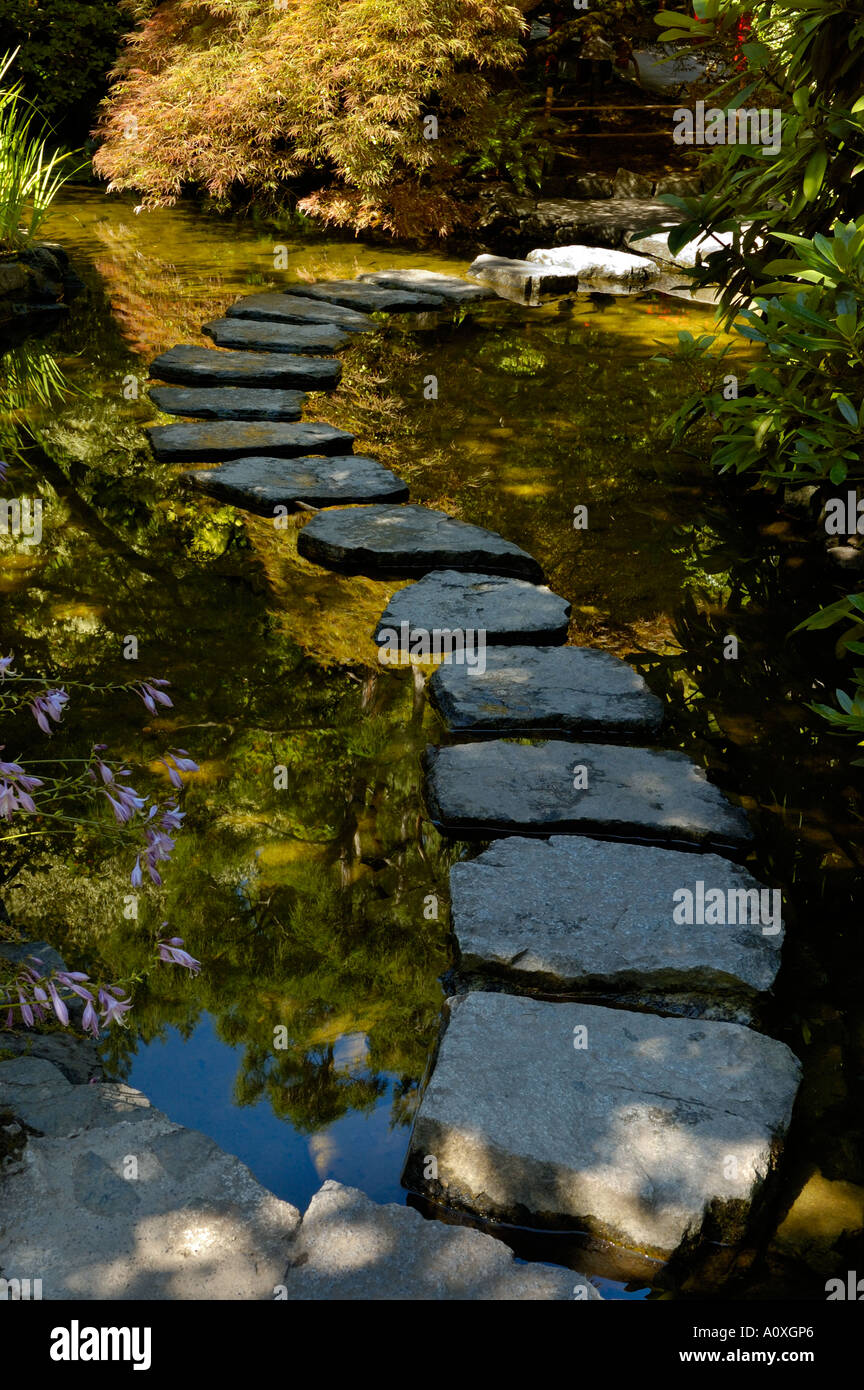 Stone steps over a Japanese water garden in Butchart Botanical Gardens ...