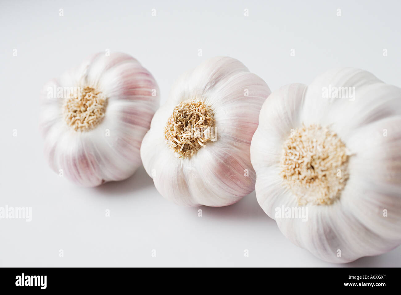 Three cloves of garlic Stock Photo - Alamy