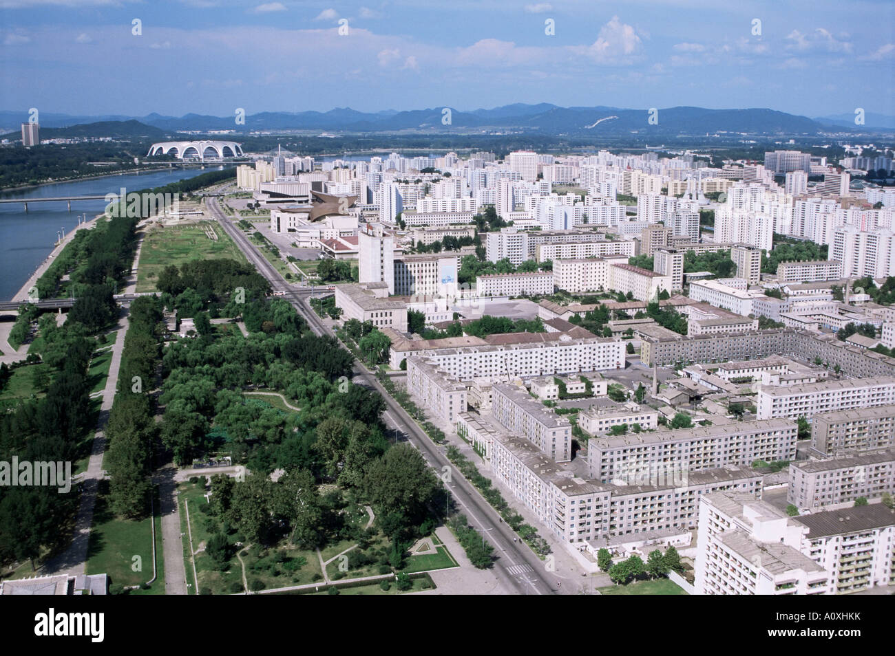 Blocks of flats beside Taedong River park and distant Mayday Stadium ...