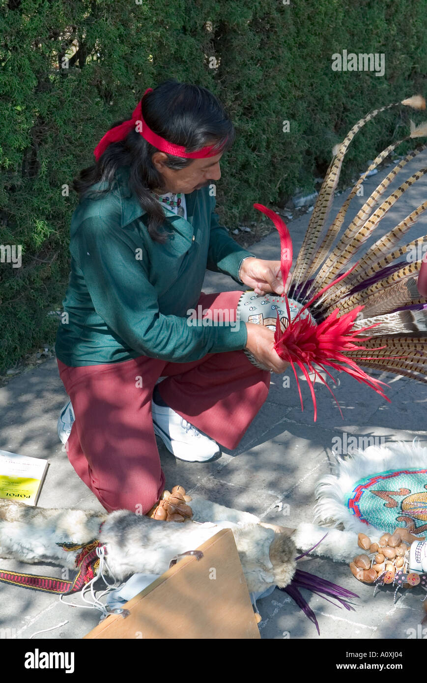 Mexican indian creating feathered head dress in Mexico City Stock Photo ...