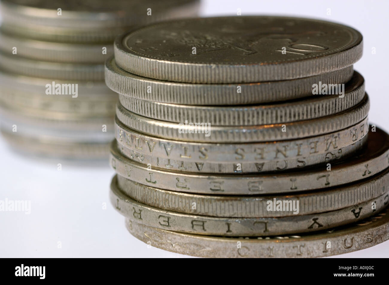 Two stacks of Old international Coins Stock Photo - Alamy