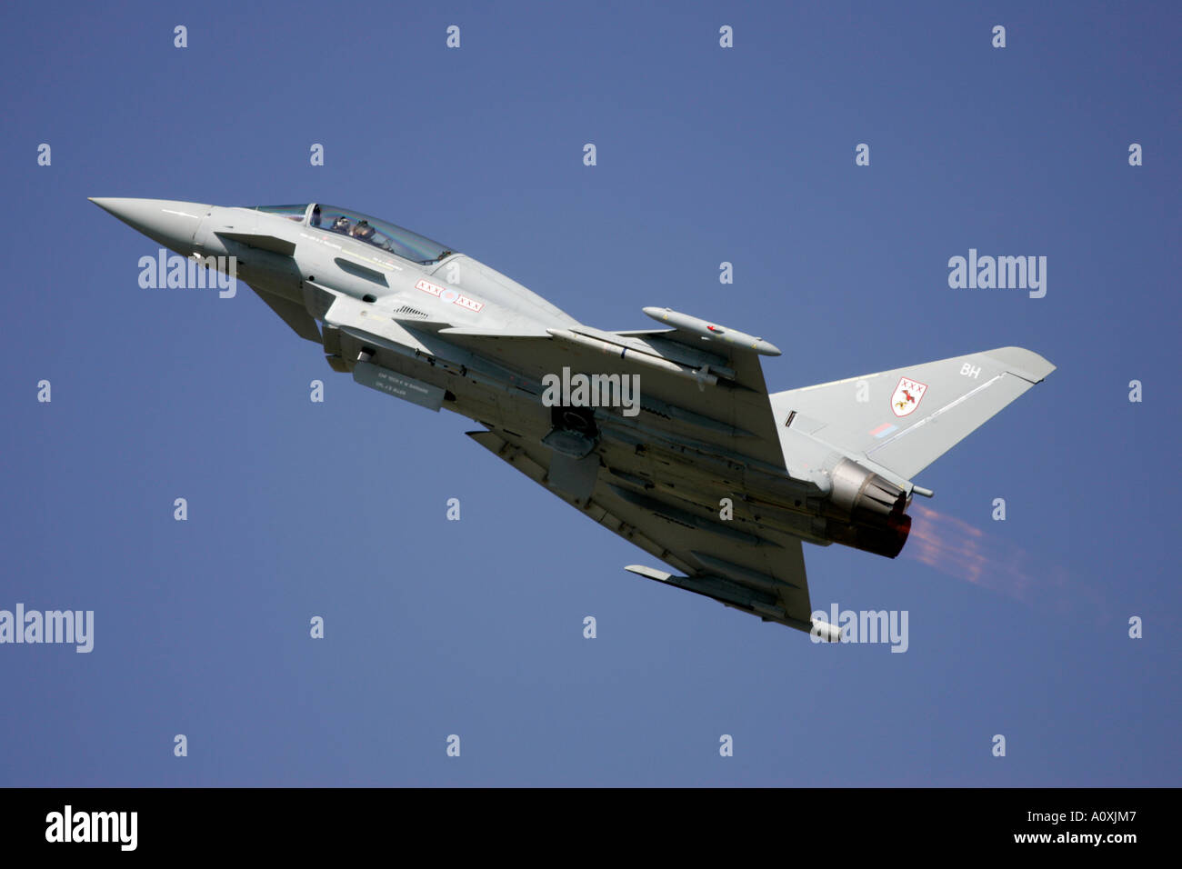 RAF Typhoon T1 Eurofighter flies low on afterburner in blue sky RIAT ...
