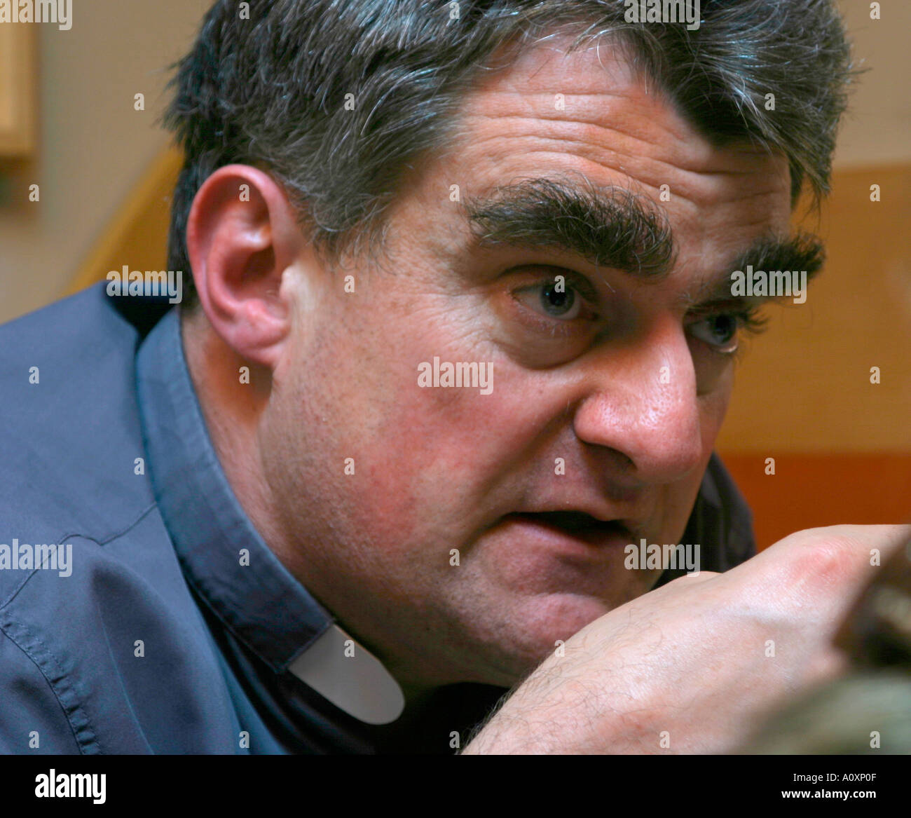 english catholic priest in conversation Stock Photo - Alamy