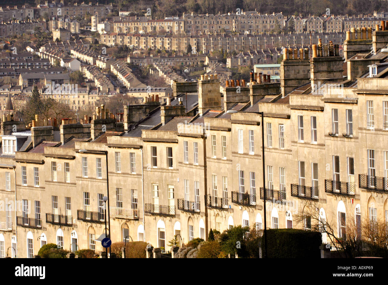 General view of terraced housing at Bathwick Hill Bath with view overlooking a residential area ...