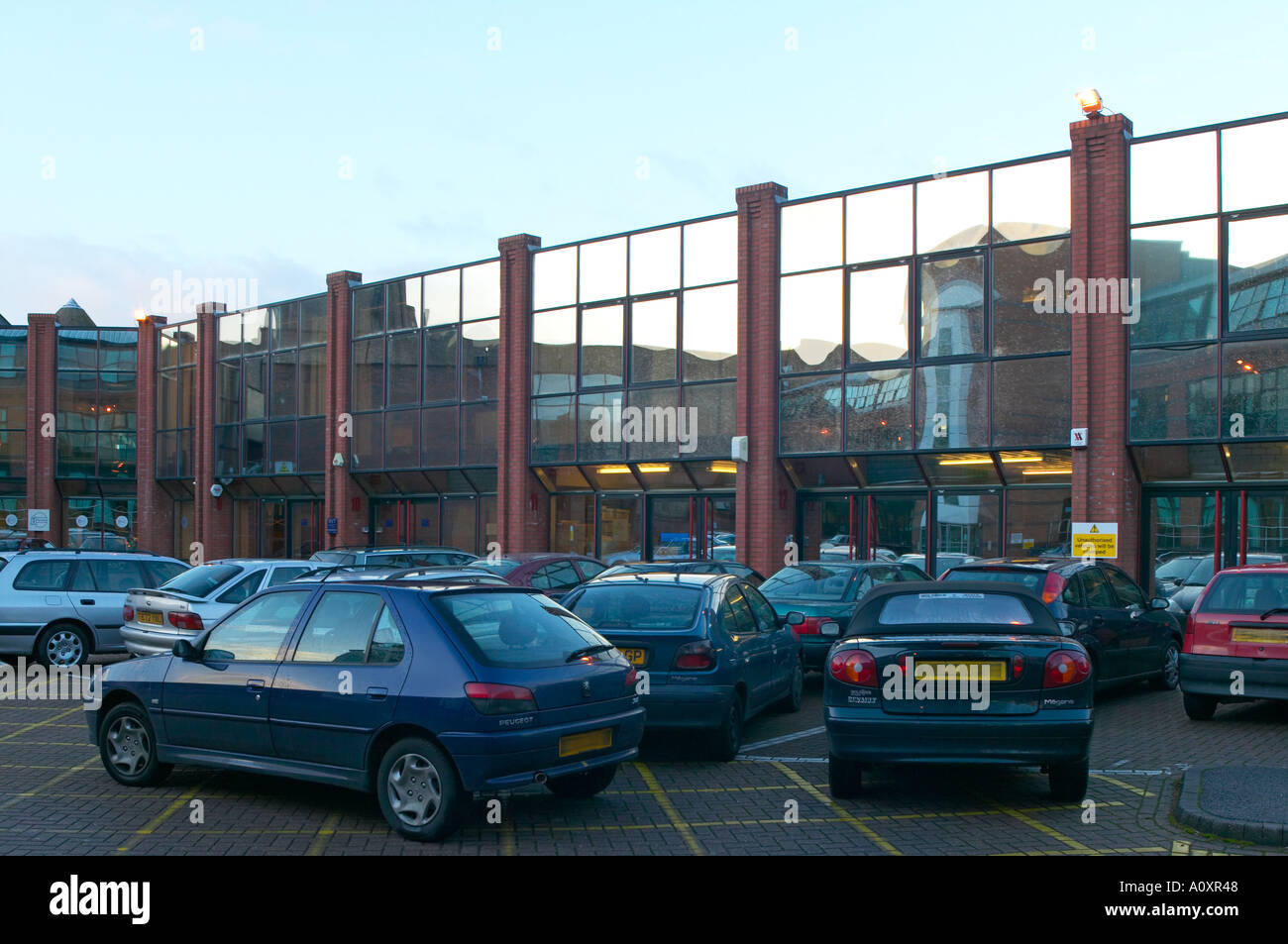 Urban Living, congested parking at business units Stock Photo - Alamy