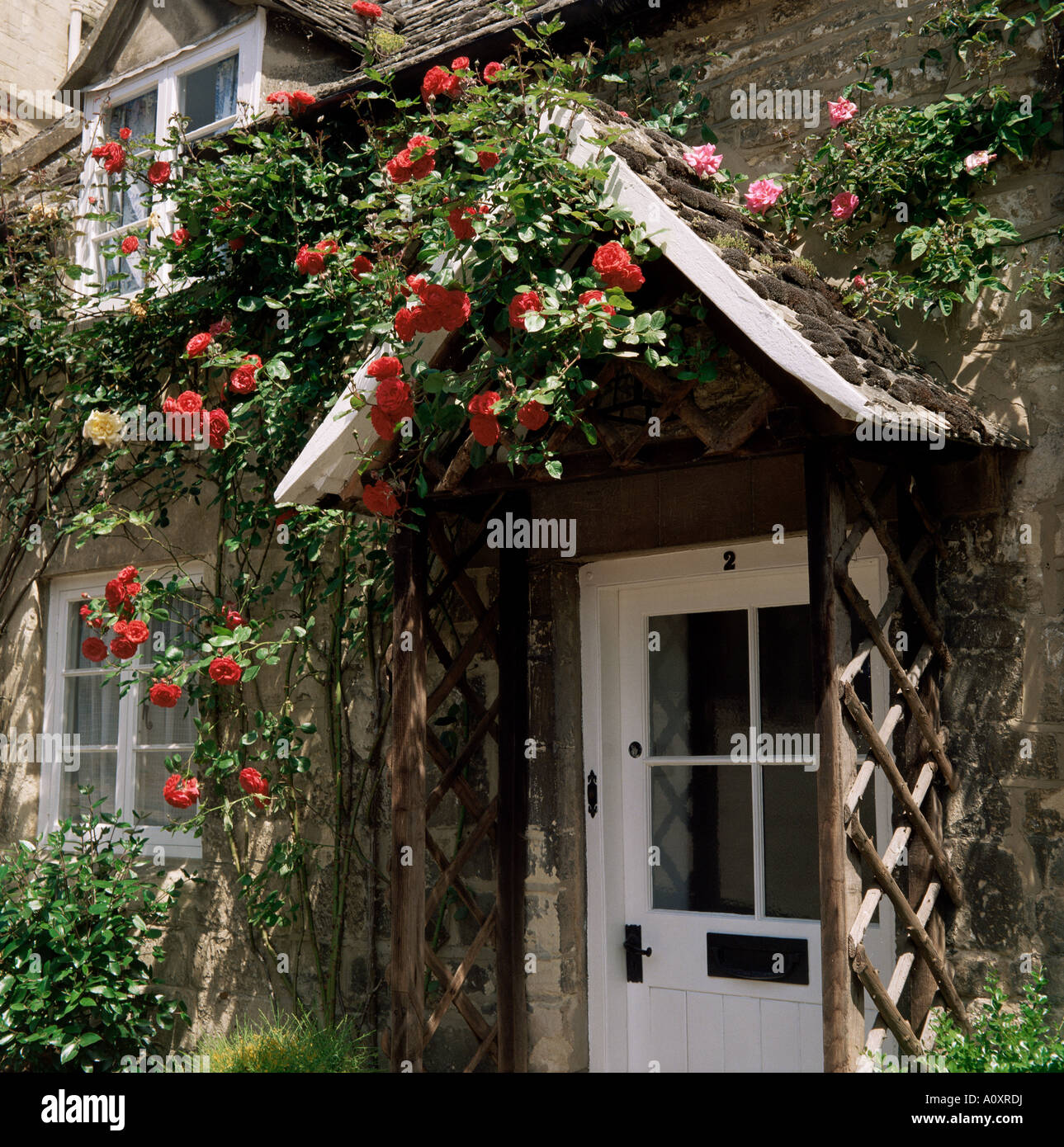 Roses round the door Vineyard Street Winchcombe Gloucestershire England ...