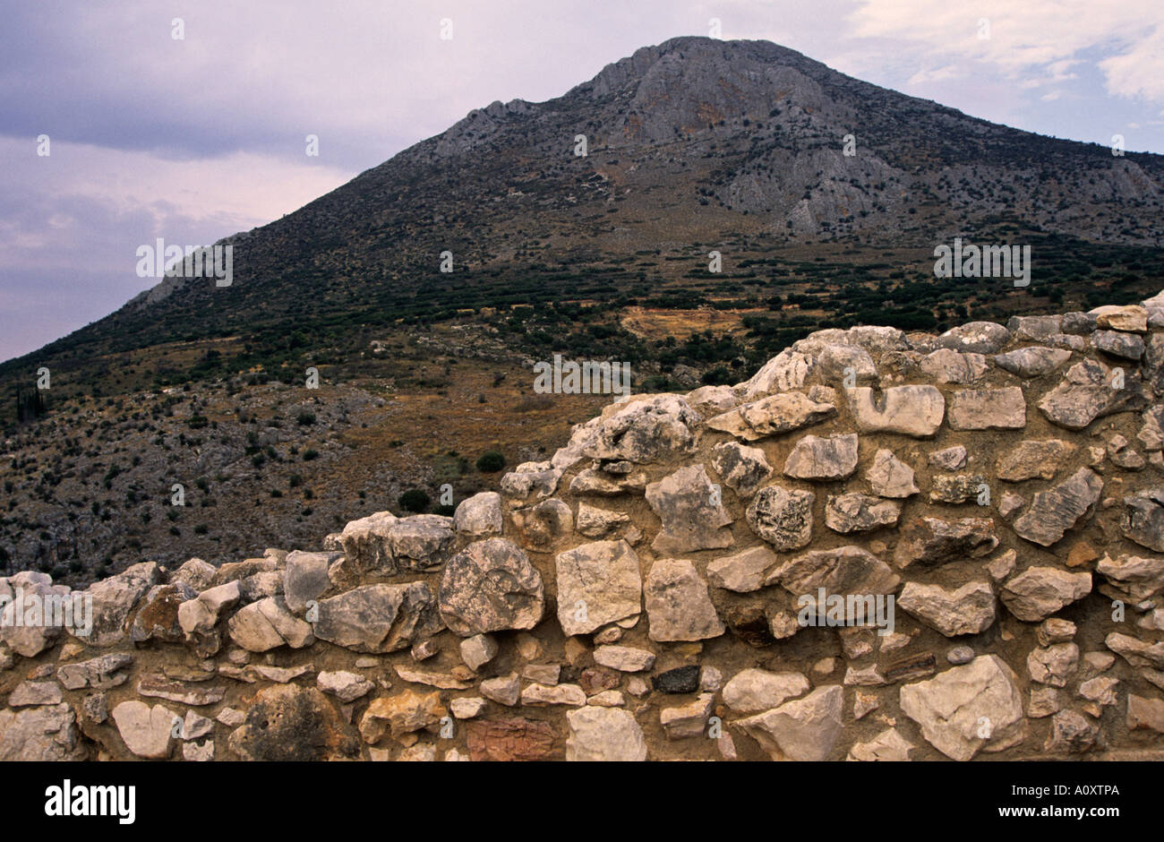 GREECE MYCENAE Pattern of mountain and perimeter stone wall of ancient ...