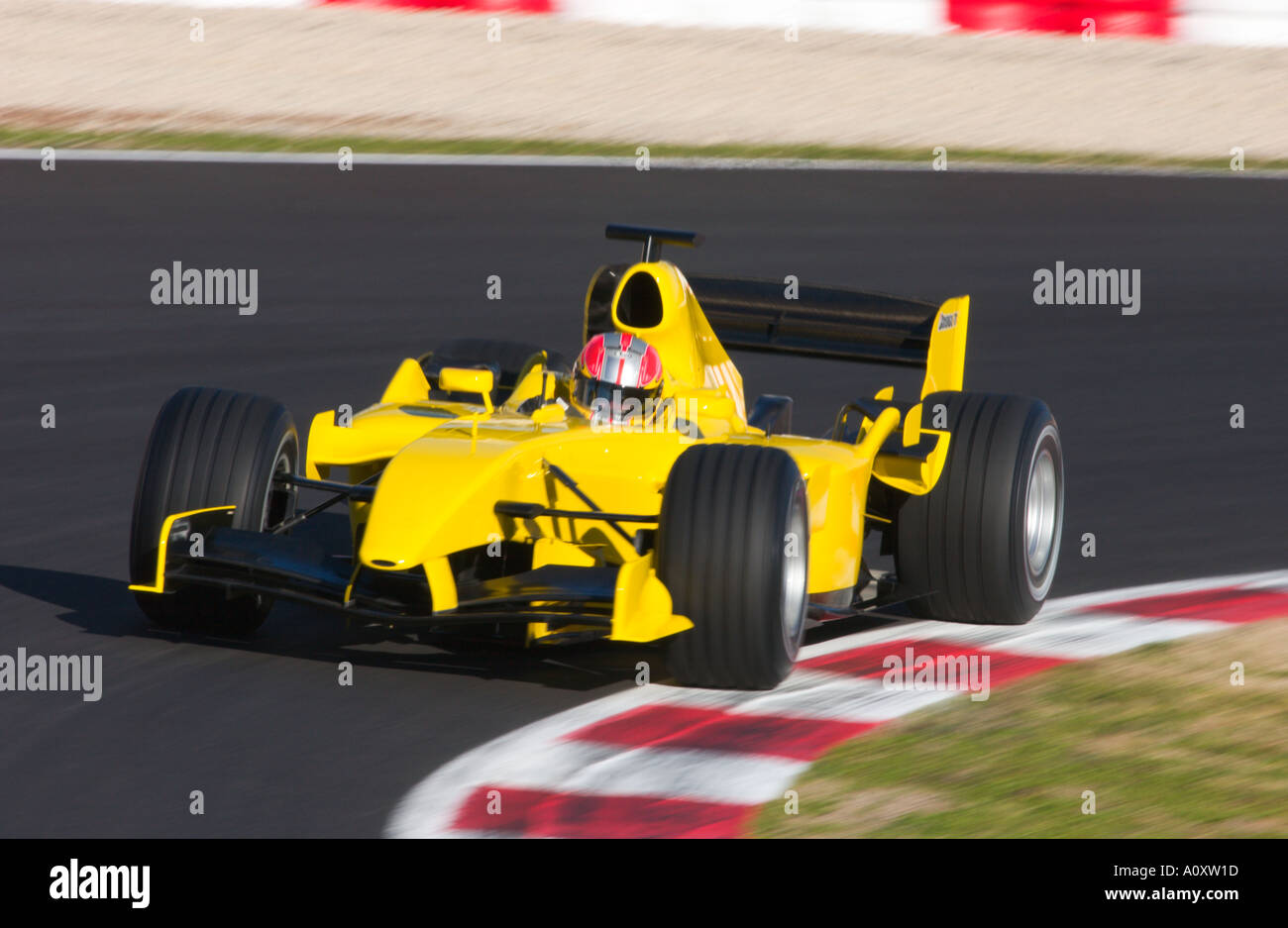 yellow Formula One racecar on the track in 2005 Stock Photo - Alamy