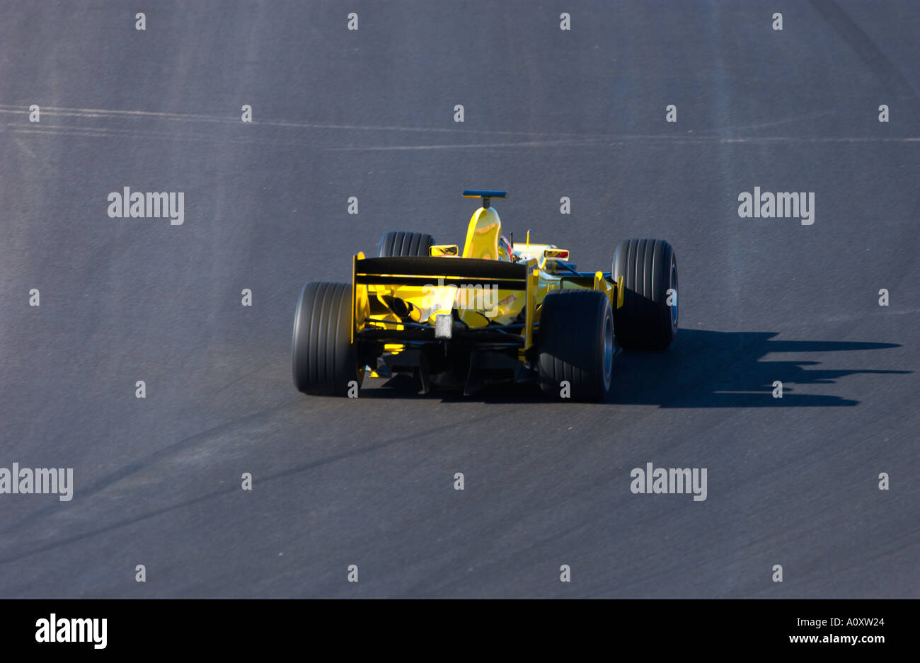 yellow Formula One racecar on the track in 2005 Stock Photo - Alamy